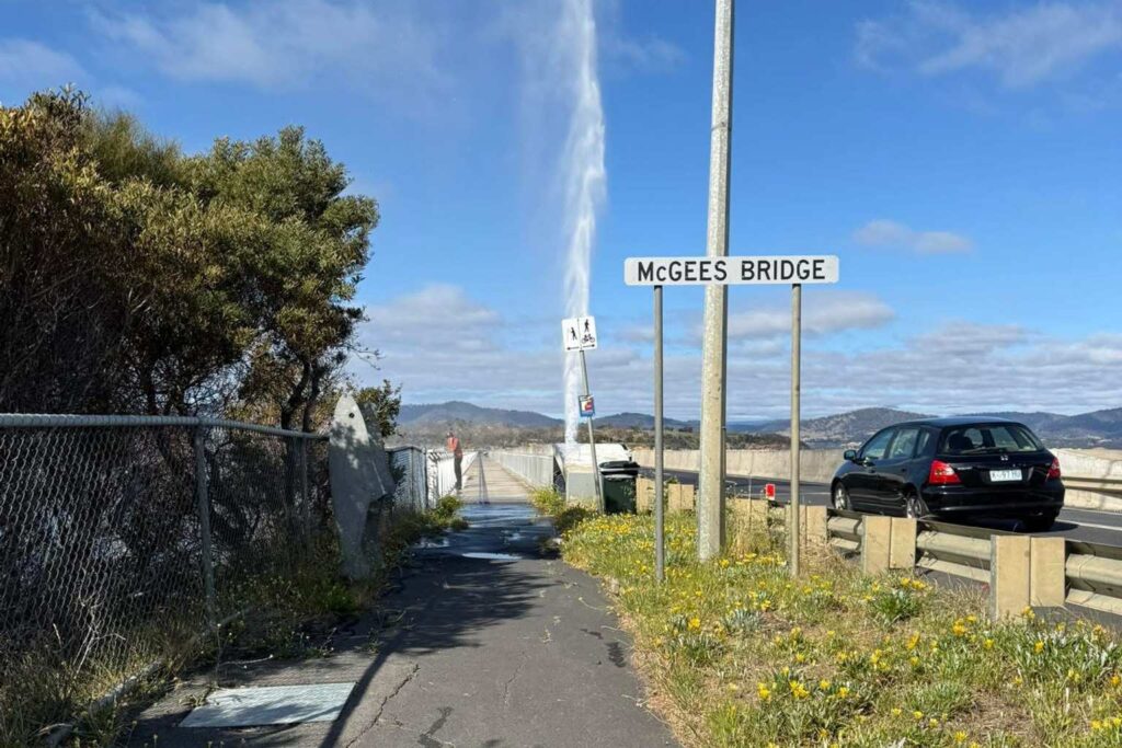 Burst water main on bridge at Midway Point sends jet gushing into air ...