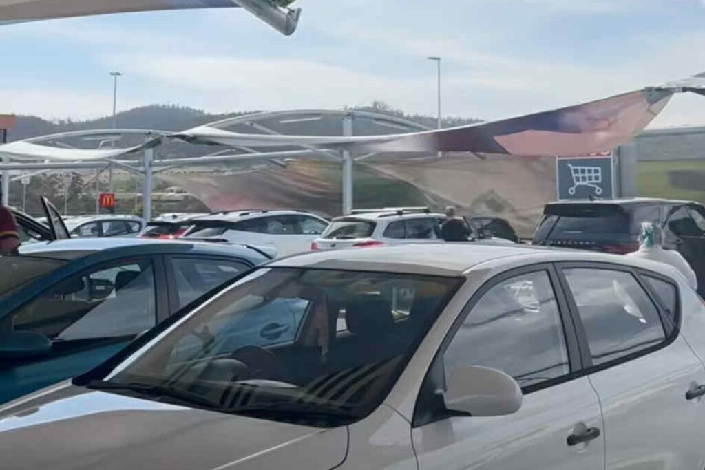 Cars damaged as strong winds rip car park sail cloth - Pulse Tasmania