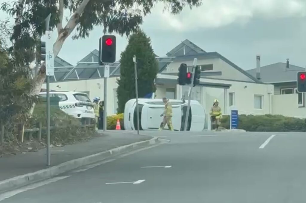 Car rolls onto side, wedges against traffic light in Rosny crash ...